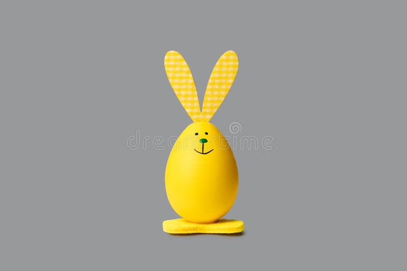 Yellow Easter Egg As Easter Bunny on Gray Background Stock Photo ...