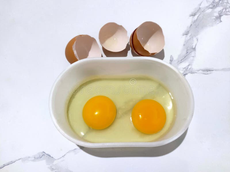 Yellow Egg and Shell on Ceramic Background Stock Image - Image of ...