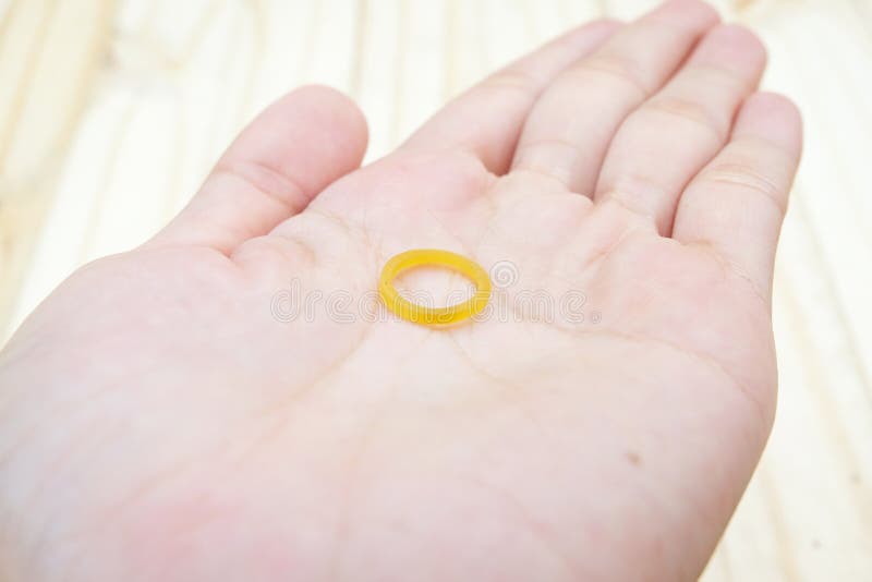 Yellow Elastic Plastic Band on Hand Stock Photo - Image of expand, band ...