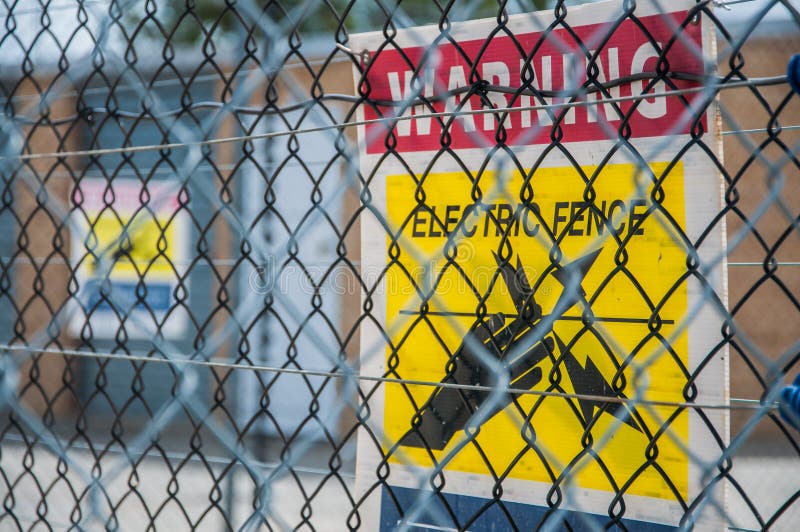 Yellow Electric Fence Sign. Stock Photo - Image of hazard, sign: 91038474