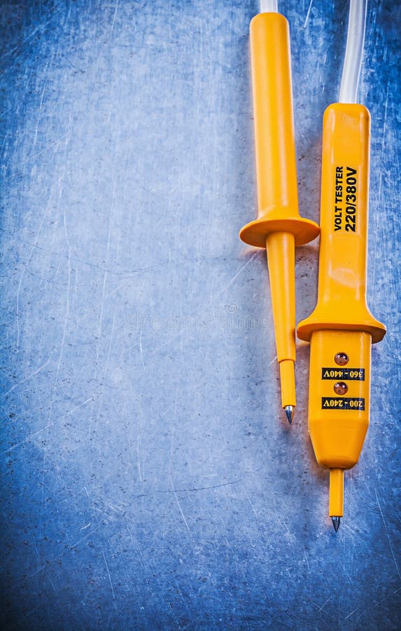 Yellow Electrical Tester on Scratched Metallic Background Stock Photo ...