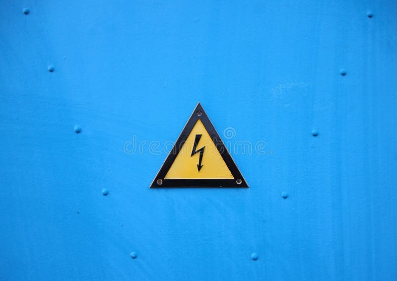 Yellow Electrical Warning Triangle Sign on Blue Background Stock Image ...