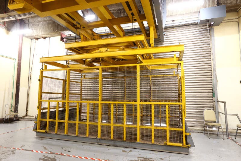 Yellow Elevator in Loading Bay To Load Heavy Machine Inside Building ...