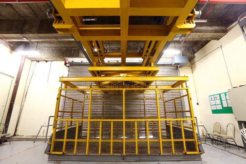 Yellow Elevator in Loading Bay To Load Heavy Machine Inside Building ...