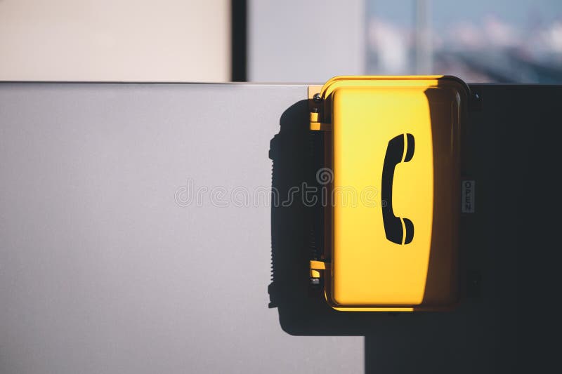 The Yellow Emergency Phone on Wall in Train Station Stock Photo - Image ...
