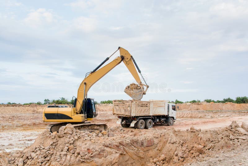 Excavator Loading A Dump Truck Stock Image - Image of bucket, activity ...