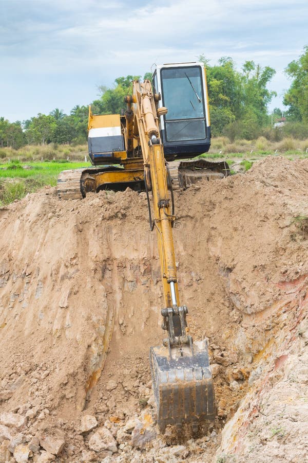 Yellow Excavator Machine Working Earth Moving Works at Construction ...