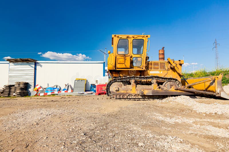 Yellow Excavator Parked on the Construction Site Stock Photo - Image of ...