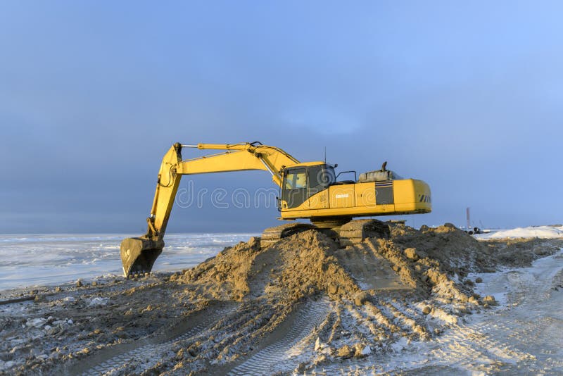 Yellow Excavator Working on Construction Site. the Road Construction ...