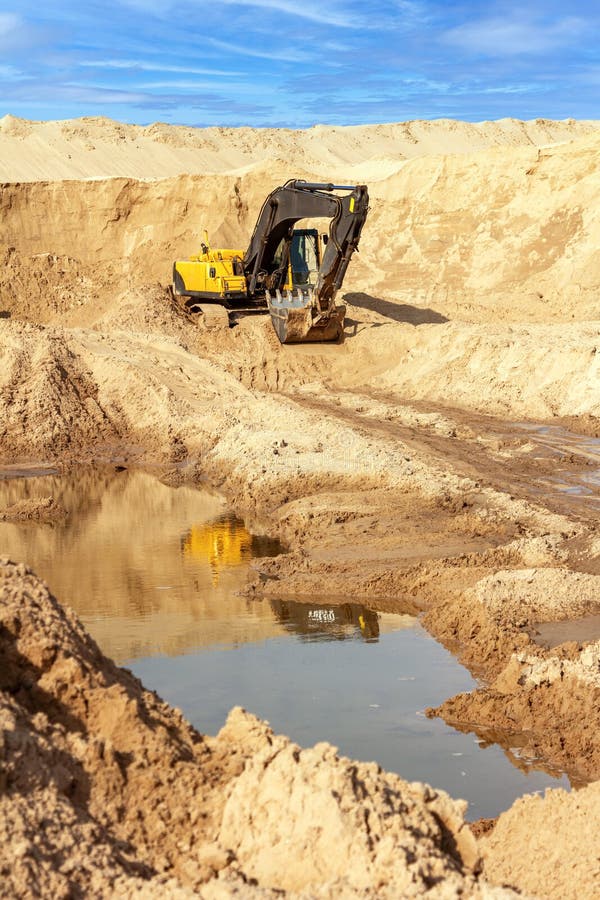 Yellow Excavator Working with Sand at Construction Site Stock Image ...