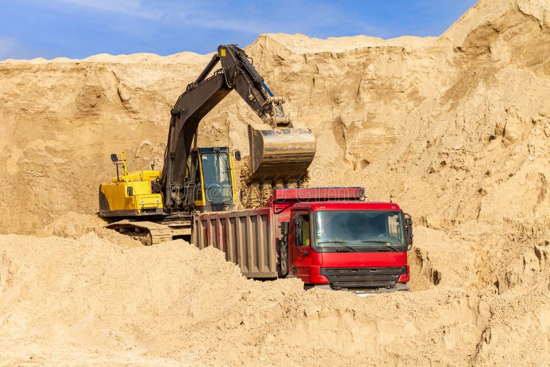 Yellow Excavator Working with Sand at Construction Site Stock Image ...