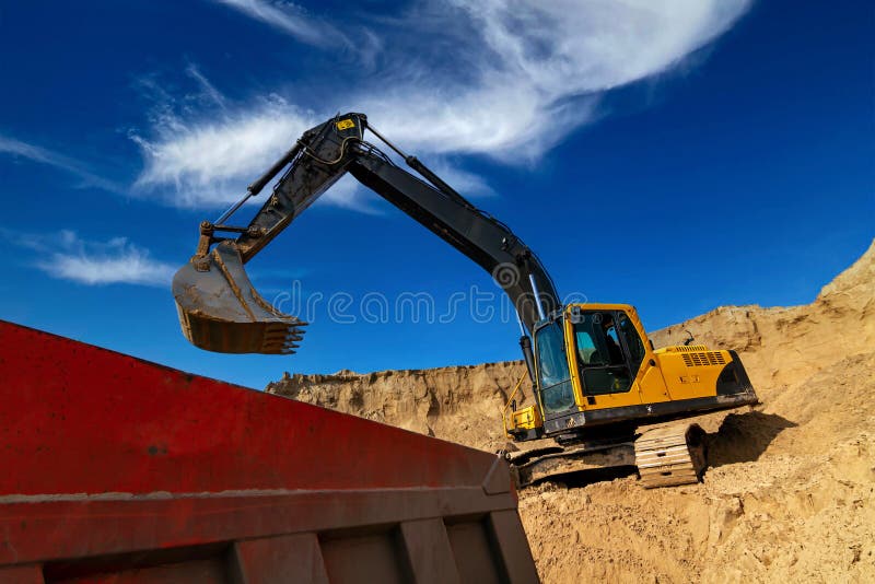 Yellow Excavator Working with Sand at Construction Site Stock Photo ...