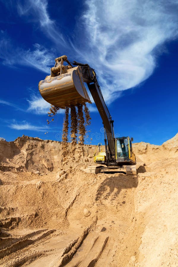 Yellow Excavator Working with Sand at Construction Site Stock Image ...
