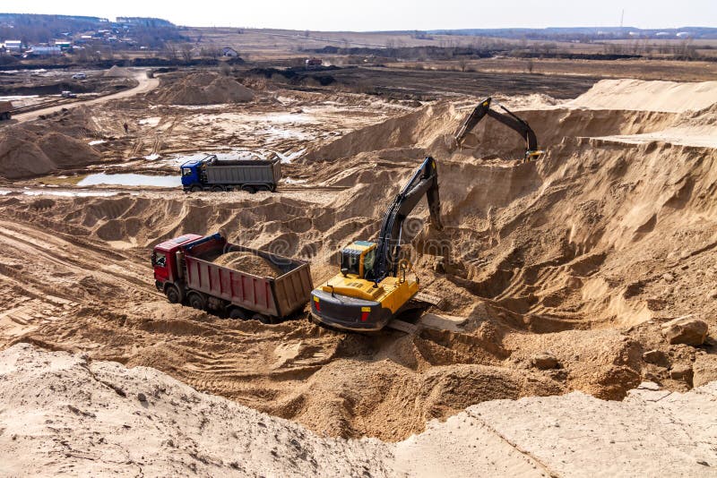 Yellow Excavator Working with Sand at Construction Site Stock Photo ...