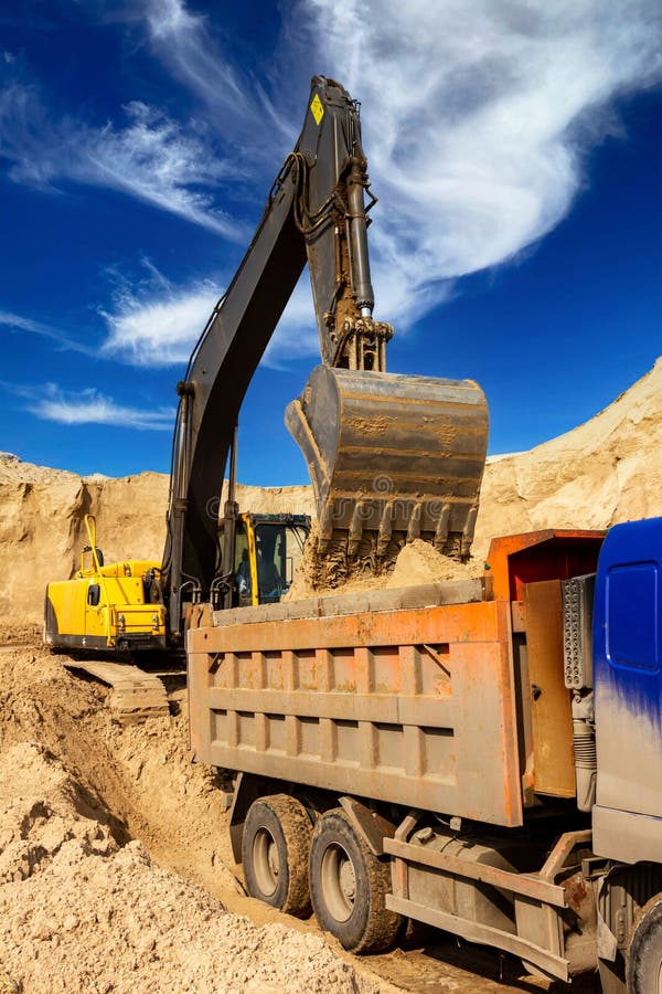 Yellow Excavator Working with Sand at Construction Site Stock Image ...