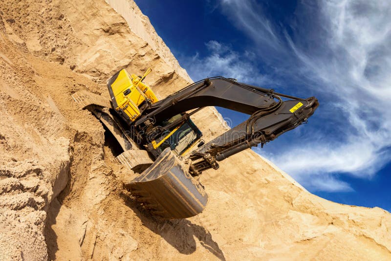 Yellow Excavator Working with Sand at Construction Site Stock Photo ...