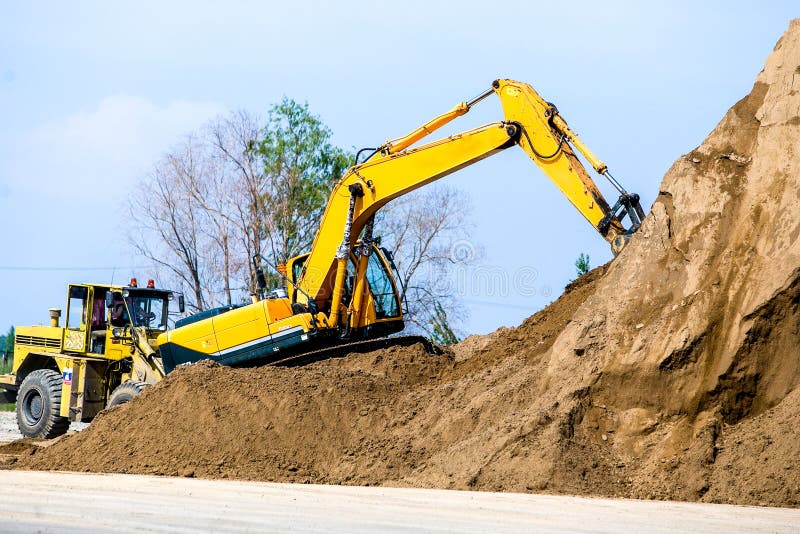 Yellow Excavator Working in Sand Quarry. Stock Photo - Image of ...