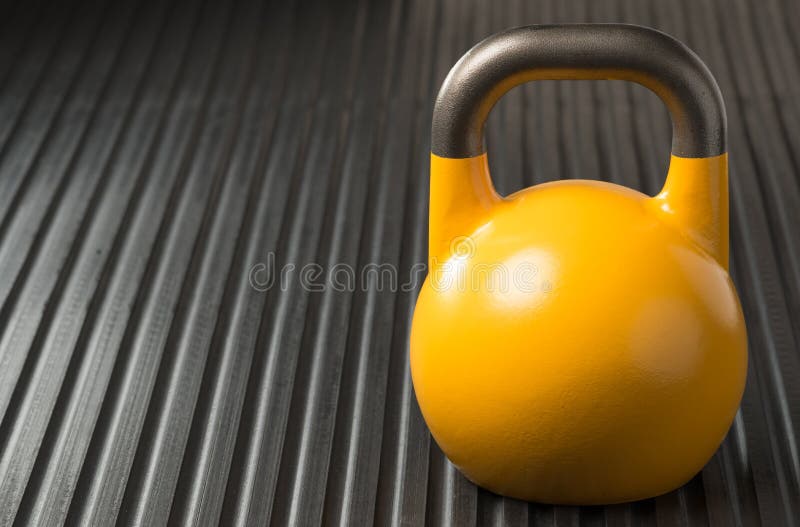 Yellow Exercise Kettlebell on a Gym Mat Stock Photo - Image of copy ...