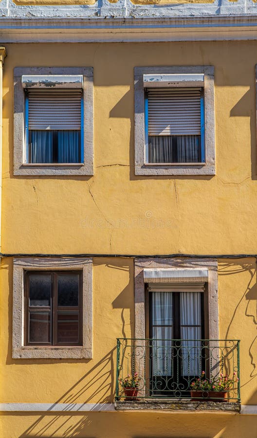 Yellow Facade with Large Windows and Balconies. Stock Image - Image of ...