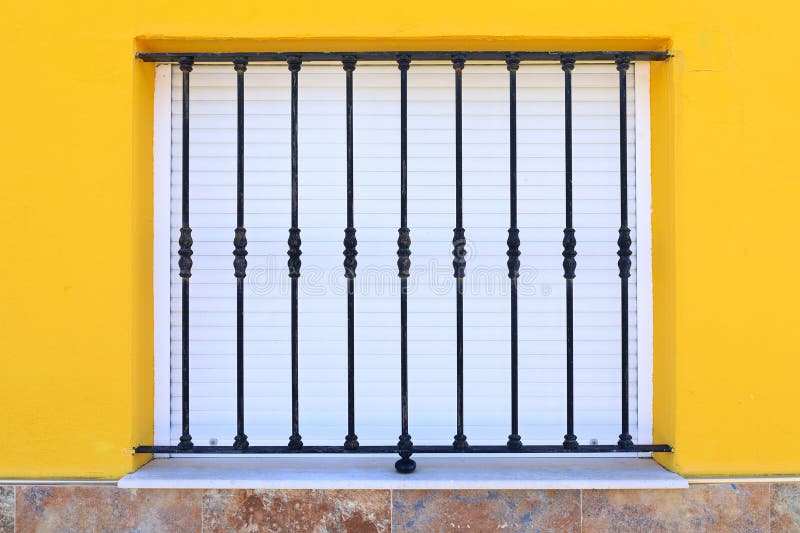 Yellow Facade with Window and Wrought Iron Railing Stock Photo - Image ...