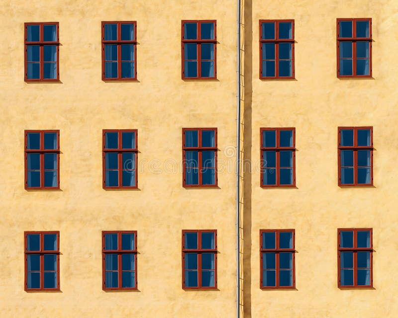 Yellow facade with windows stock photo. Image of ancient - 30585724
