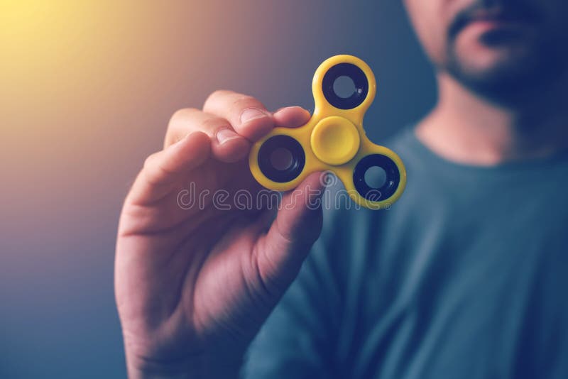 Yellow Fidget Spinner in Male Hand Stock Image - Image of mechanism ...