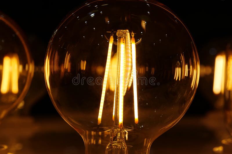 Yellow Filaments of Light Bulb Close-up Stock Image - Image of blinking ...