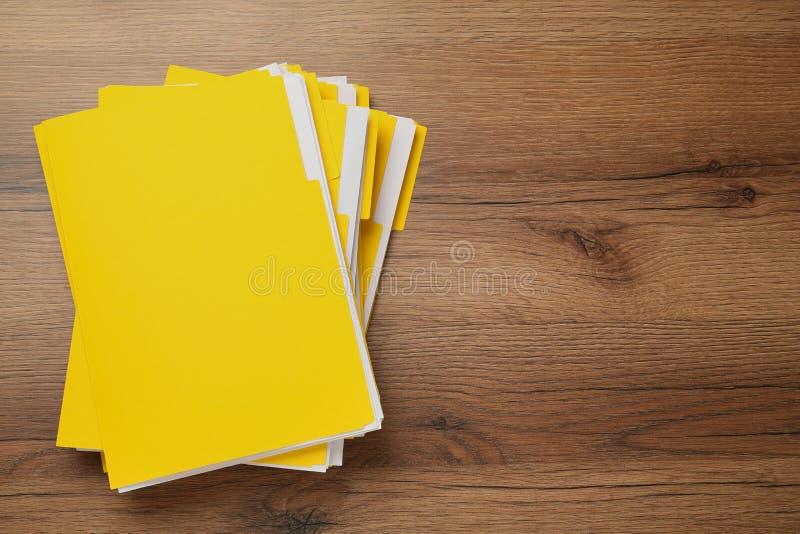 Yellow Files with Documents on Wooden Table, Top View. Space for Text ...