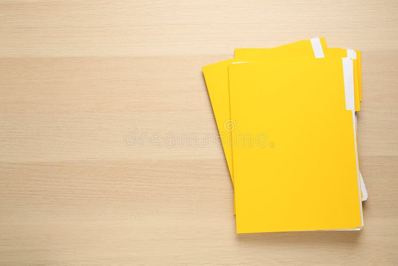 Yellow Files with Documents on Wooden Table, Top View. Space for Text ...
