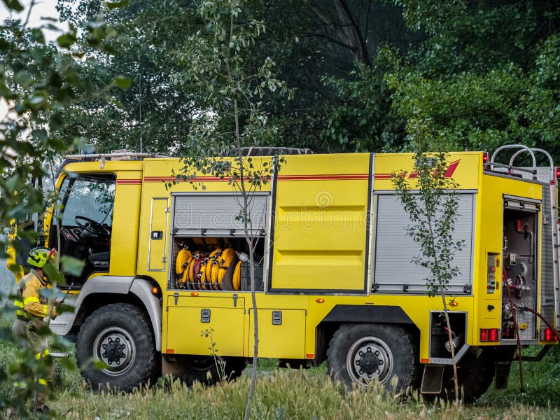 Fire Engine Working Against Fire in a Forest Stock Image - Image of ...