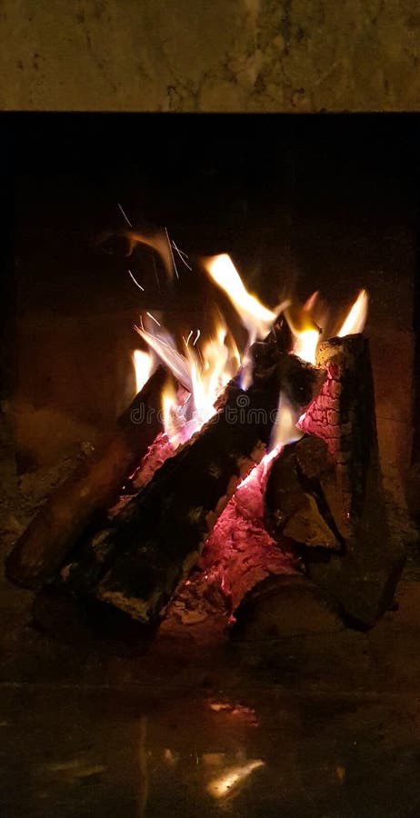 Yellow fire in Fireplace stock image. Image of night - 137919909