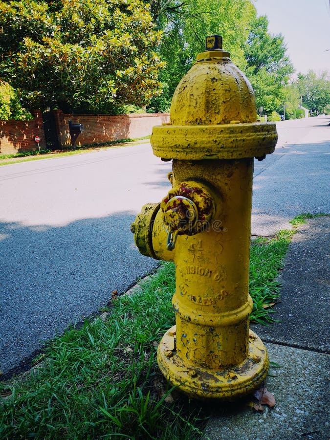 Yellow Fire Hydrant on the Street Stock Image - Image of supply, hdrb ...