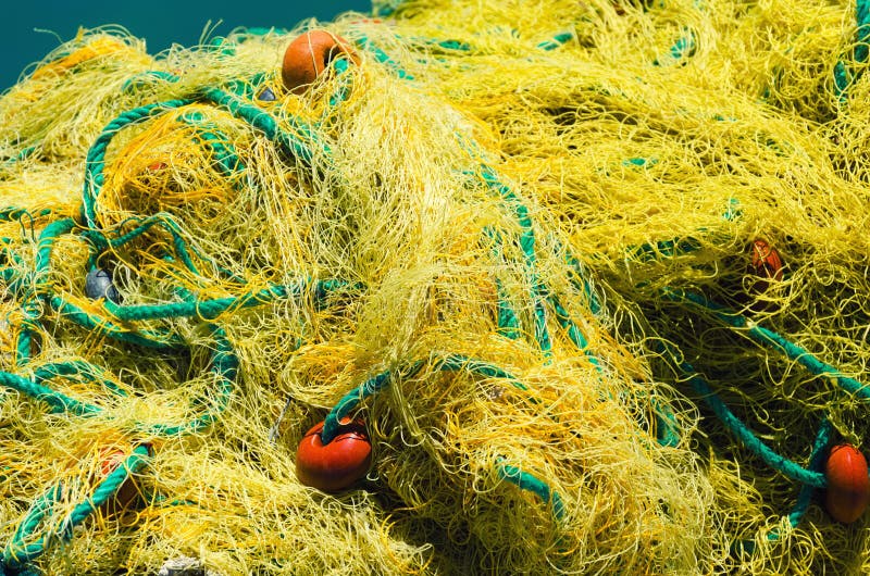 Yellow Fishing Net with Floats and Ropes Stock Photo - Image of float ...