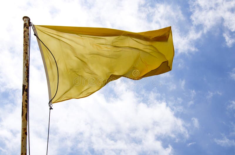 Yellow Flag Waving on the Blue Sky. Stock Photo - Image of tropical ...