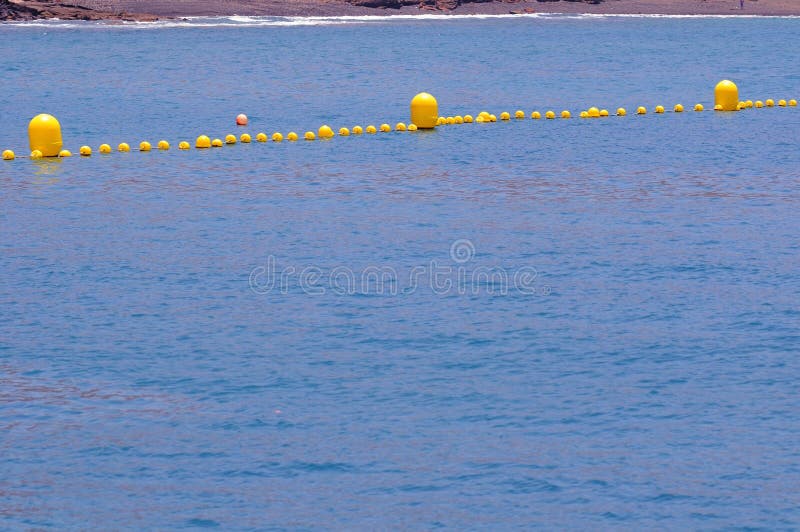 Yellow Floaters stock image. Image of swimming, blue - 33632687