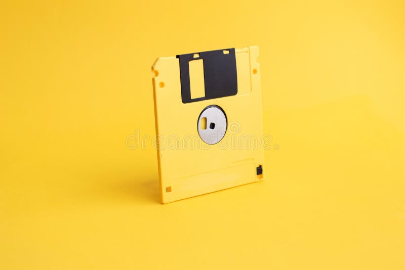 Yellow Floppy Disk on Yellow Background Stock Image - Image of plastic ...