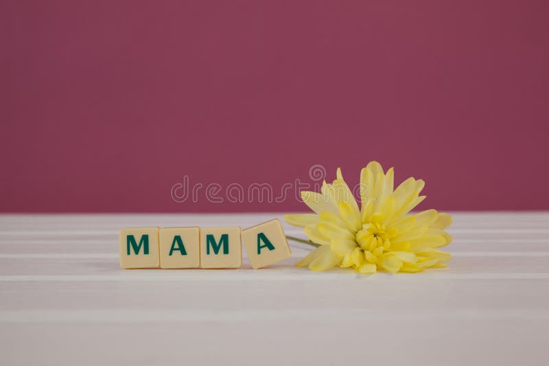 Yellow Flowers Next To Blocks Displaying Mama Message Stock Photo ...
