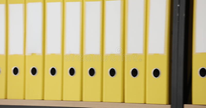 Yellow Folders with Folders and Documents in Long Rows on Shelves Stock ...