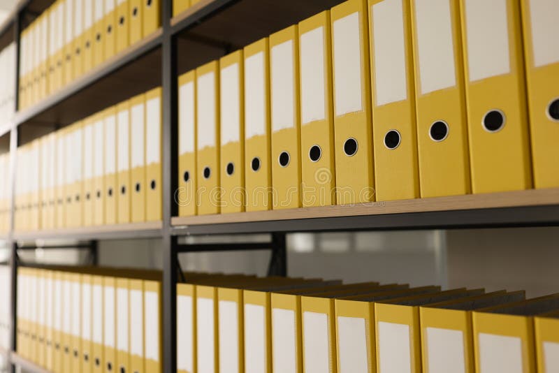 Yellow Folders with Materials Put in Long Rows on Shelves Stock Image ...