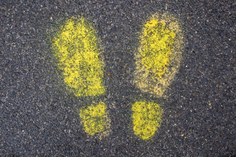 Yellow Footprints on Asphalt Stock Image - Image of paint, abstract ...