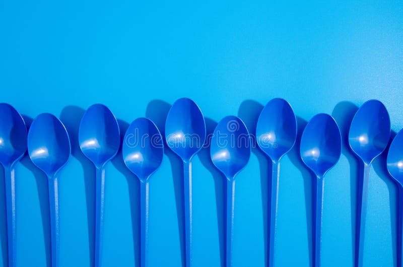 Pattern of Blue Plastic Spoons on Blue Background. Blue Color of 2020 ...