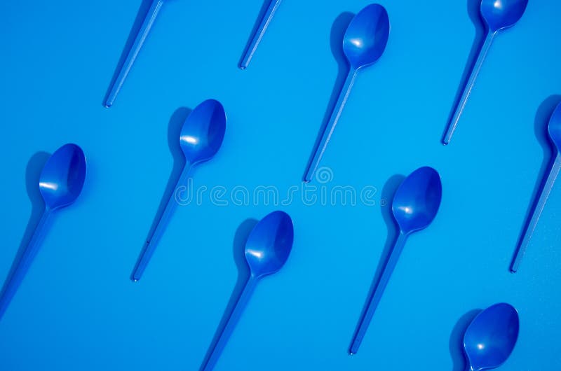 Pattern of Blue Plastic Spoons on Blue Background. Blue Color of 2020 ...