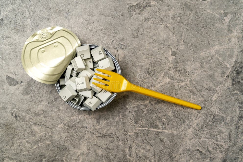 Yellow Fork and Tin Can Full of Computer Keyboard Keys Stock Photo ...