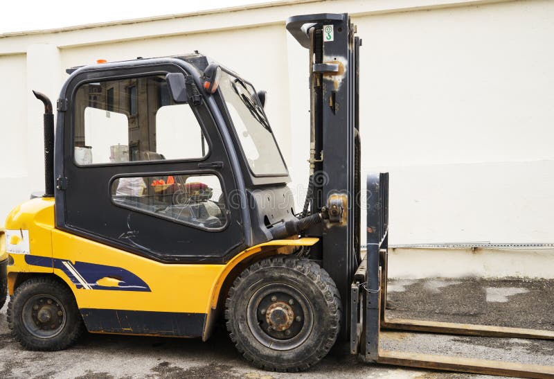 Yellow Forklift Stands on a Construction Site Stock Photo - Image of ...