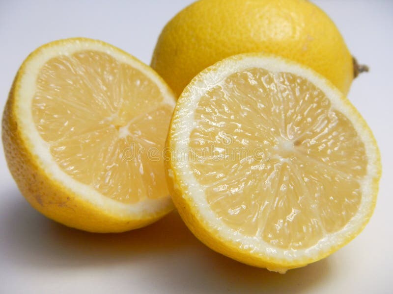 Yellow Fresh Lemon Cut on a White Table Stock Image - Image of piece ...