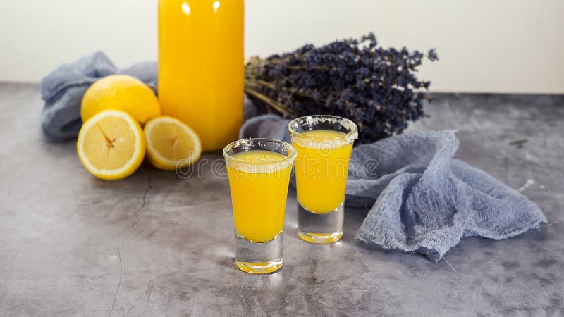 Yellow Fresh Shot Cocktail or Lemonade with Lemon Stock Image - Image ...