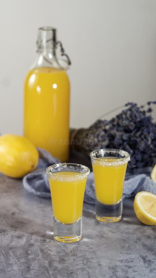 Yellow Fresh Shot Cocktail or Lemonade with Lemon Stock Photo - Image ...
