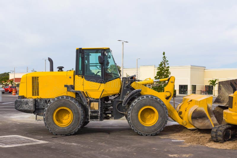Front End Loader Dumping Stone and Sand in a Mining Quarry Stock Photo ...