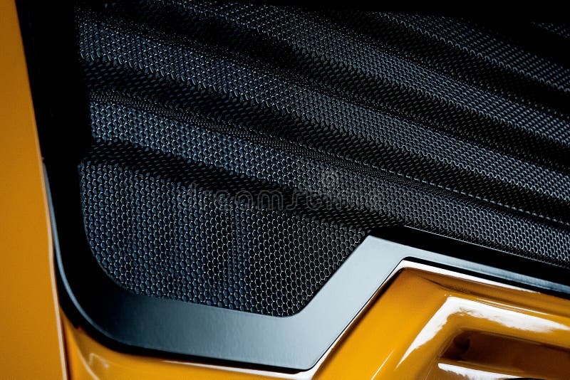 Yellow Front Panel of a Car Tractor. Industry Technologies, Metal Mesh ...