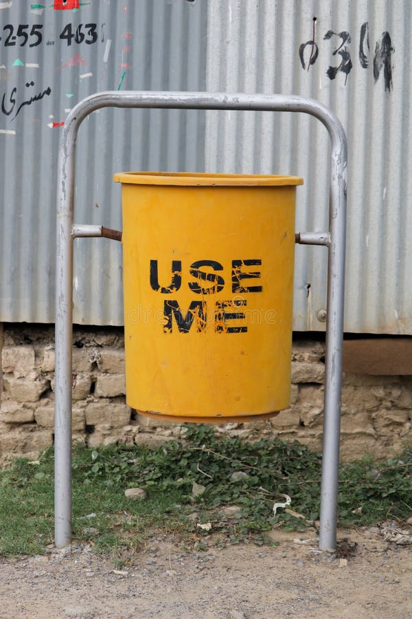Yellow Garbage Can Installed in Rural Area Stock Photo - Image of ...
